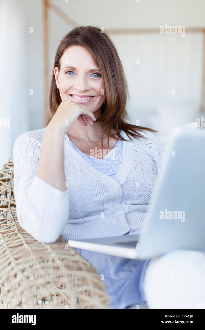 Woman operating laptop outdoors hi-res stock photography and images - Alamy