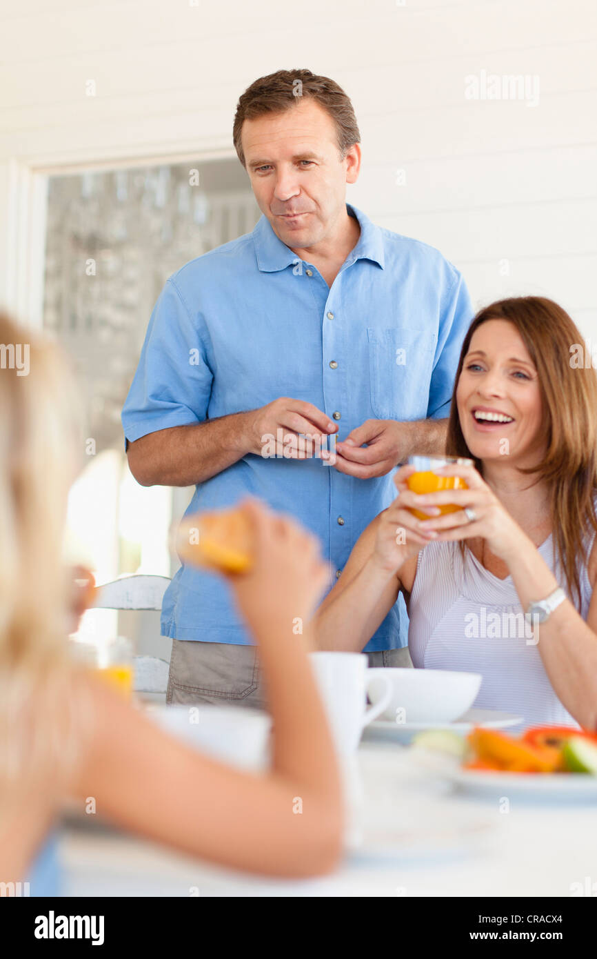 Two girls man talking table hi-res stock photography and images - Alamy