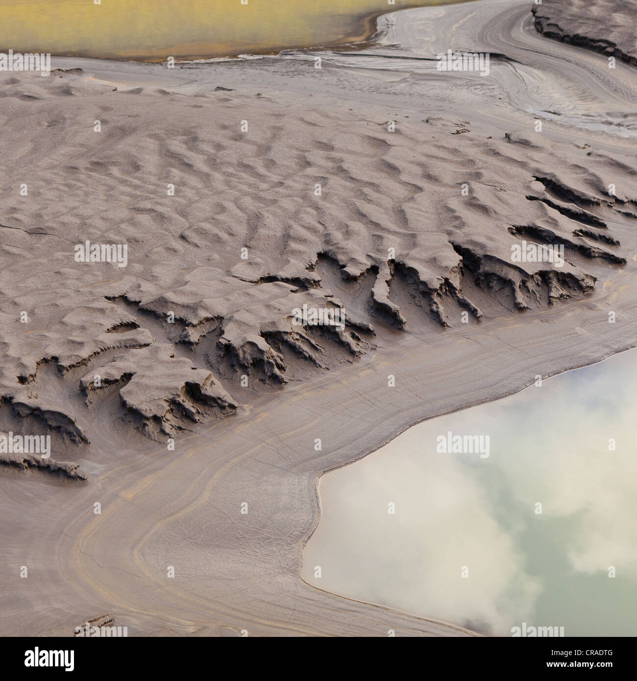 River bed and mud flats with ash from volcanic eruptions, Virkisjokull ...