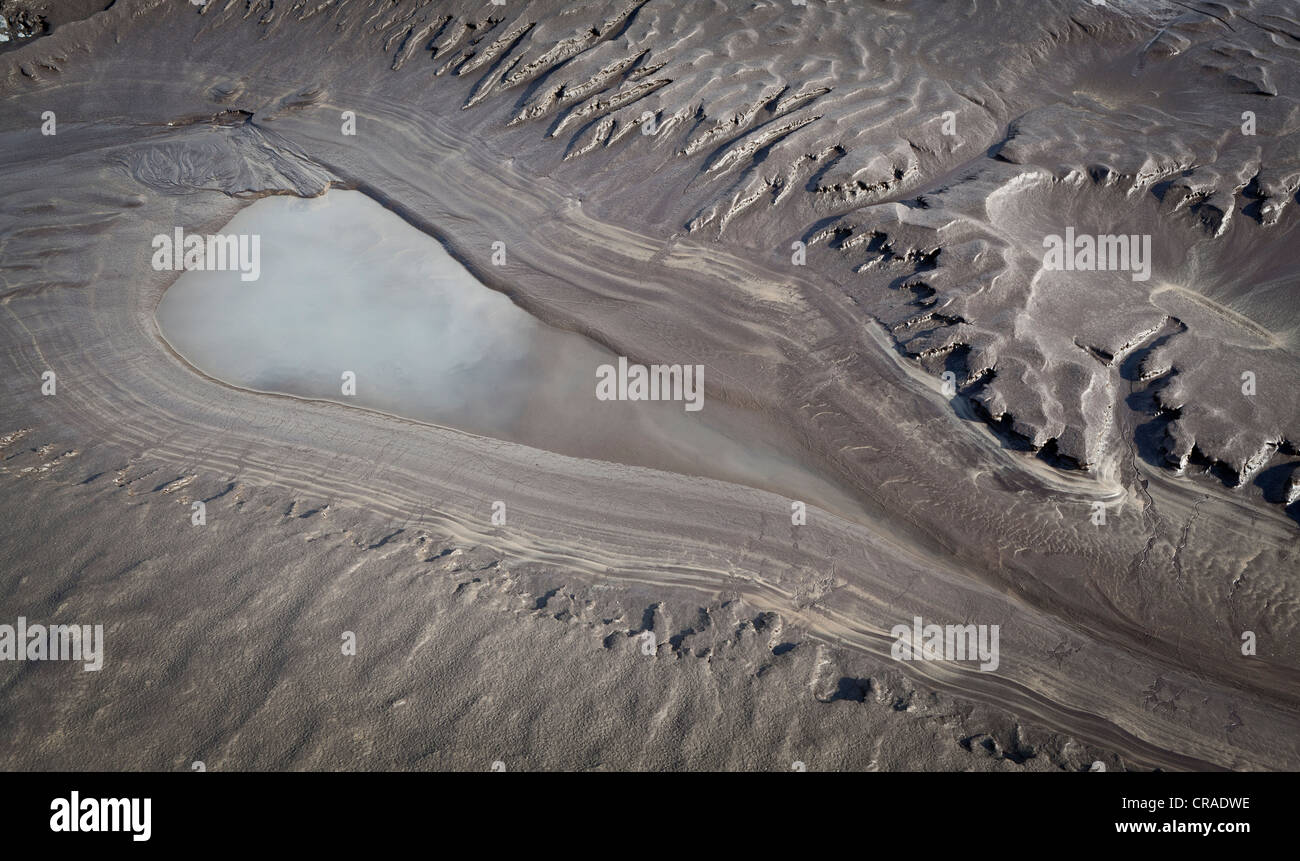 River bed and mud flats with ash from volcanic eruptions, Virkisjokull ...