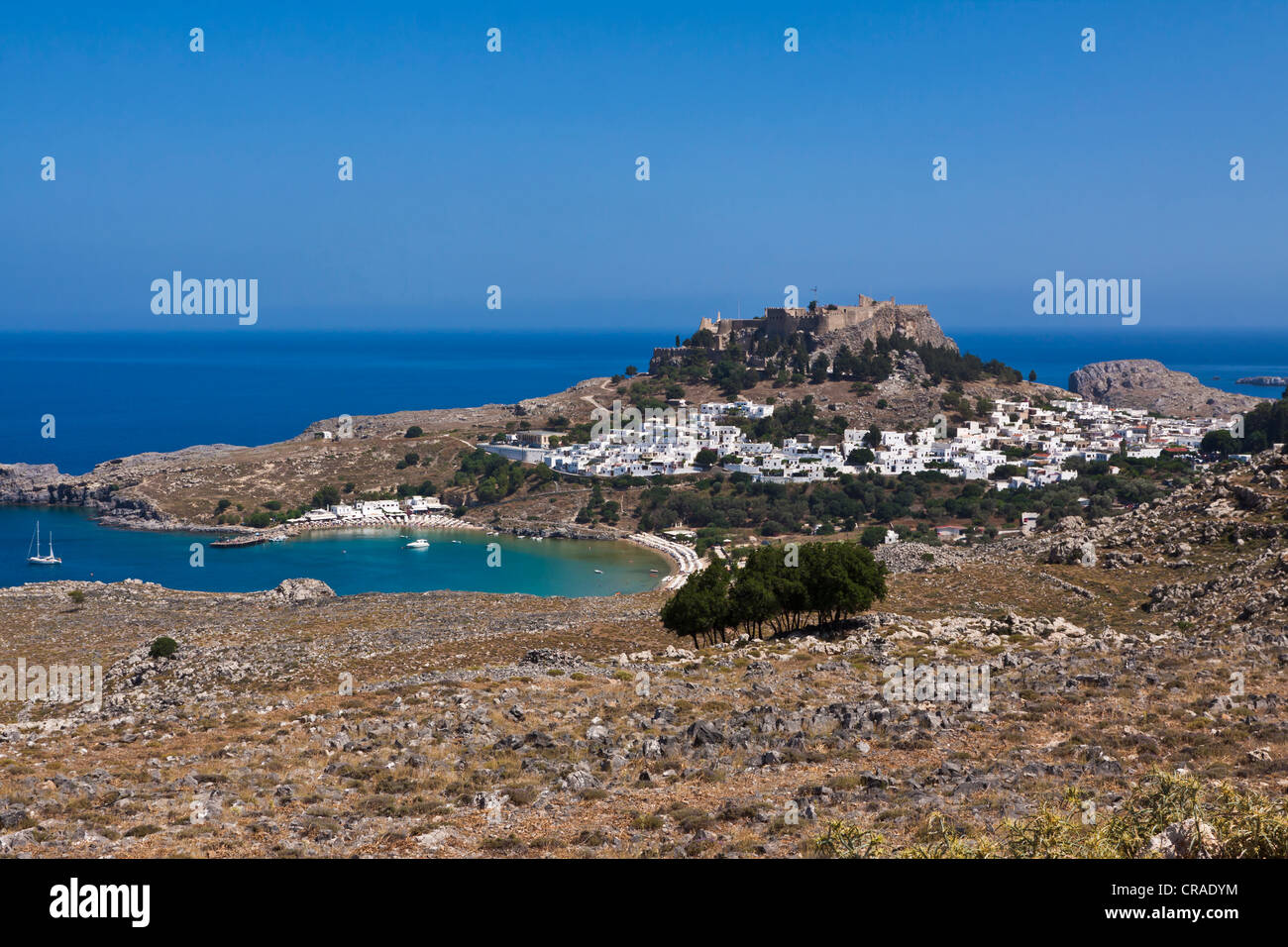 Lindos Bay, Lindos with the Acropolis of Lindos, Rhodes, Greece, Europe ...