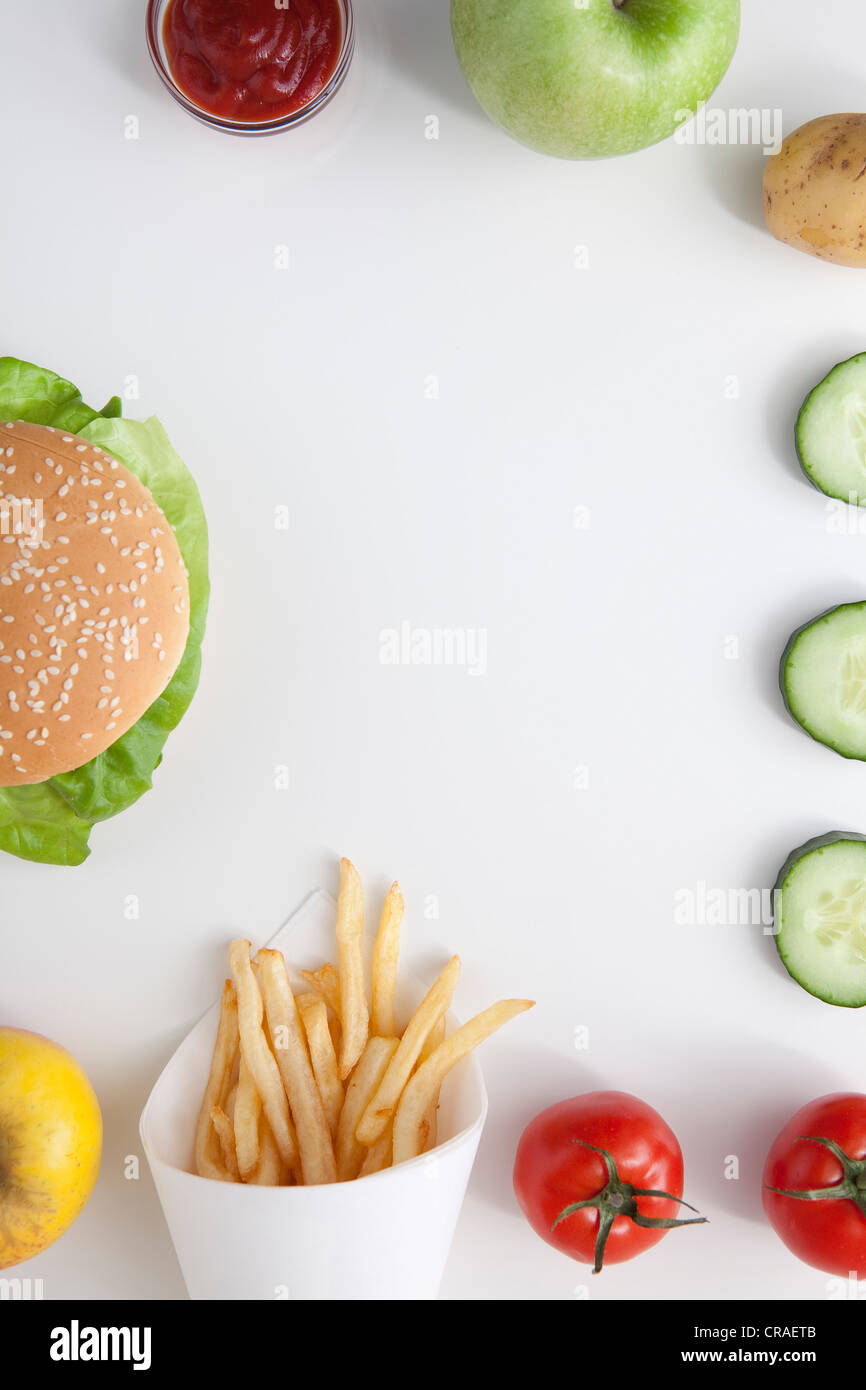 Fruit, vegetables and fries, burger, fast food Stock Photo - Alamy