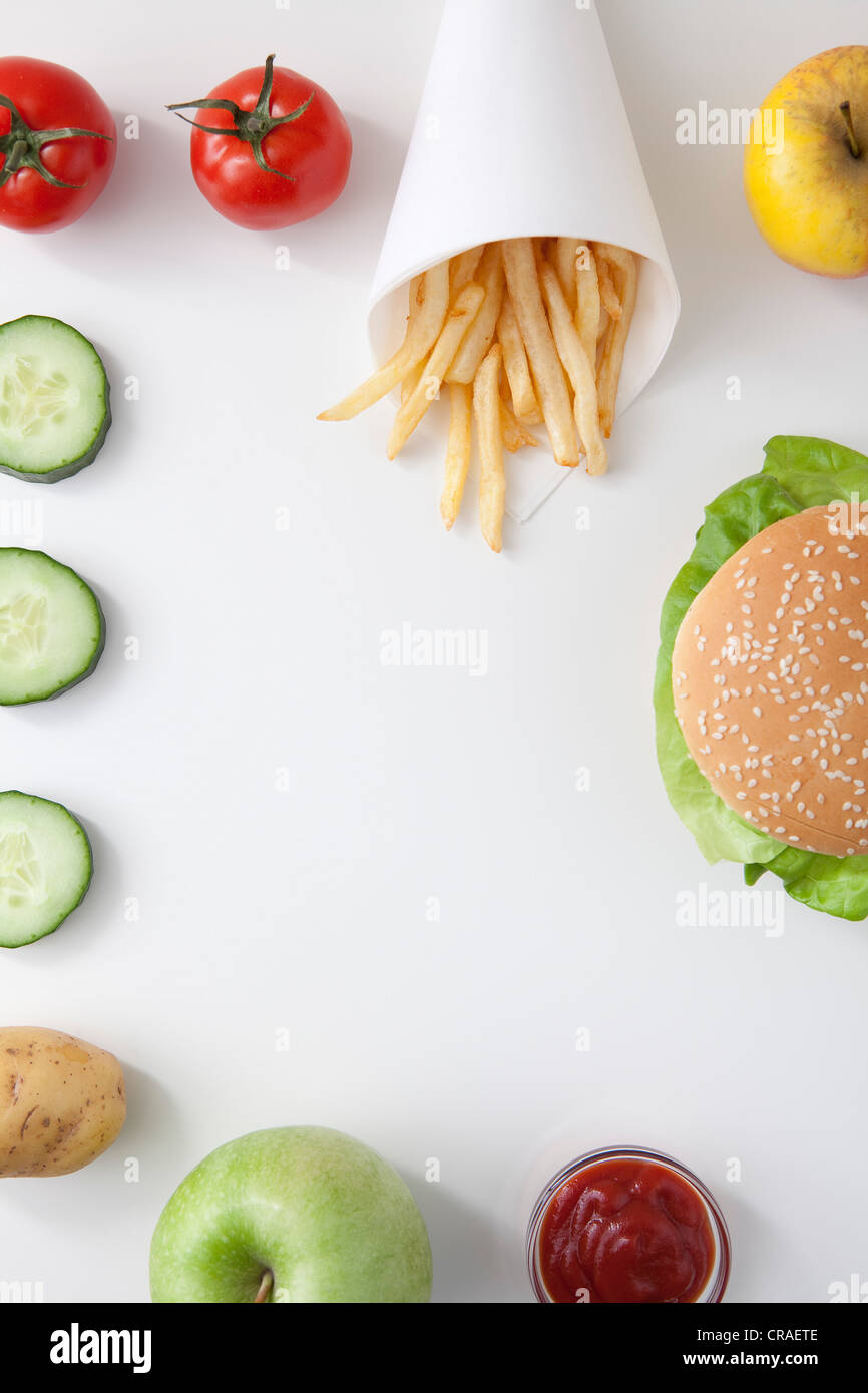 Fruit, vegetables and fries, burger, fast food Stock Photo - Alamy