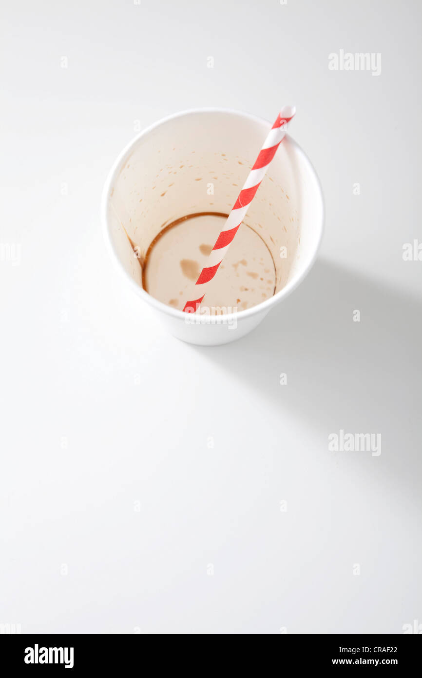 Empty paper cup with a straw Stock Photo - Alamy