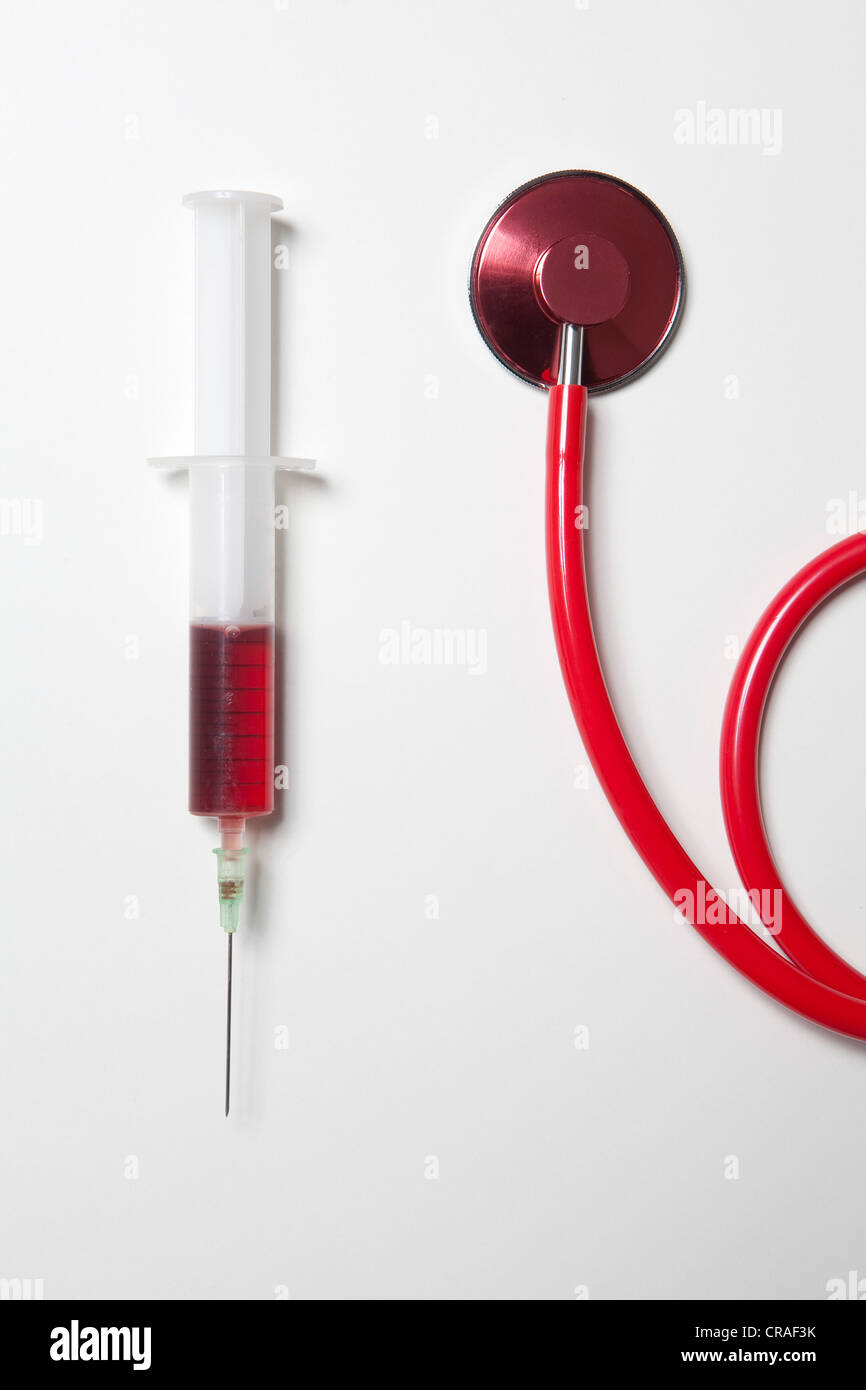 Syringe with blood and a stethoscope, blood donation, taking of a blood ...