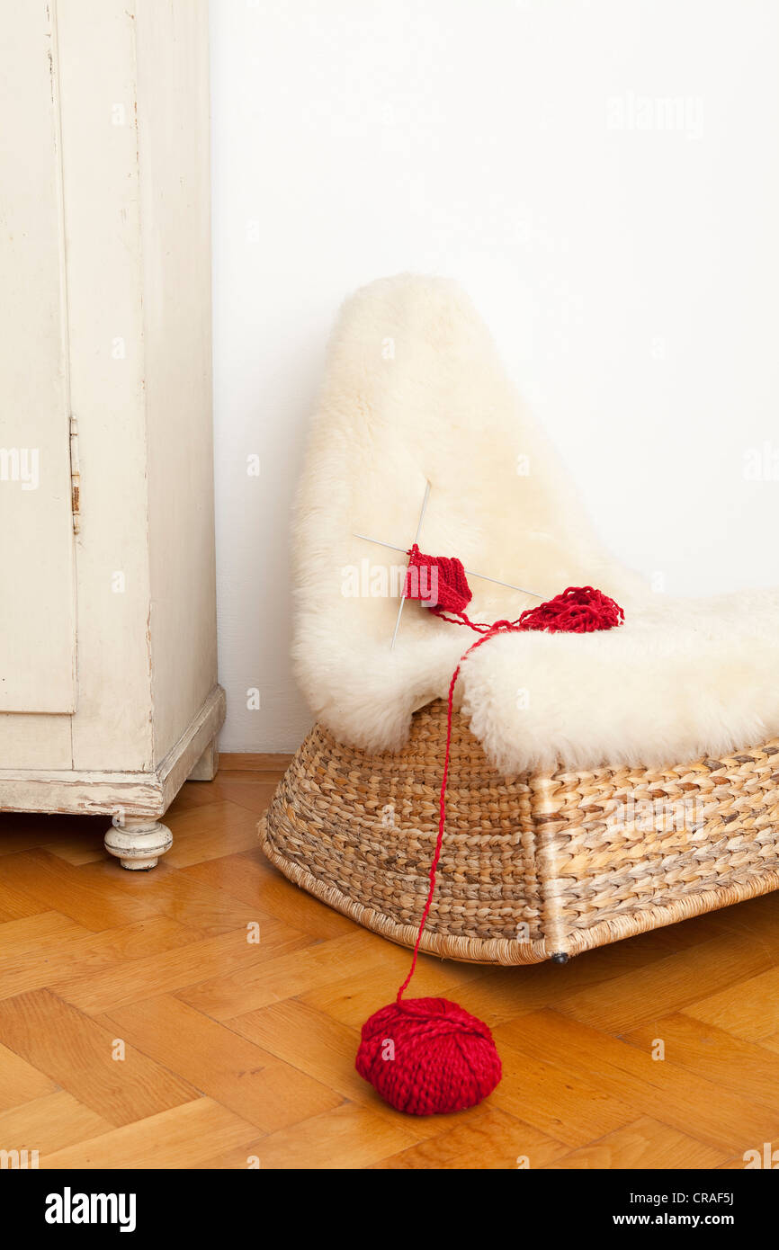 Knitting lying on a rocking chair, at home Stock Photo - Alamy