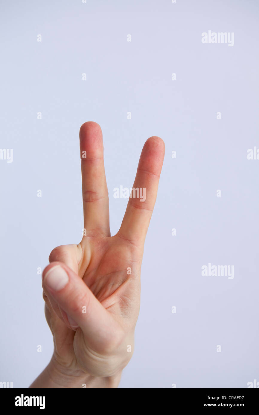 Victory sign, hand sign Stock Photo - Alamy