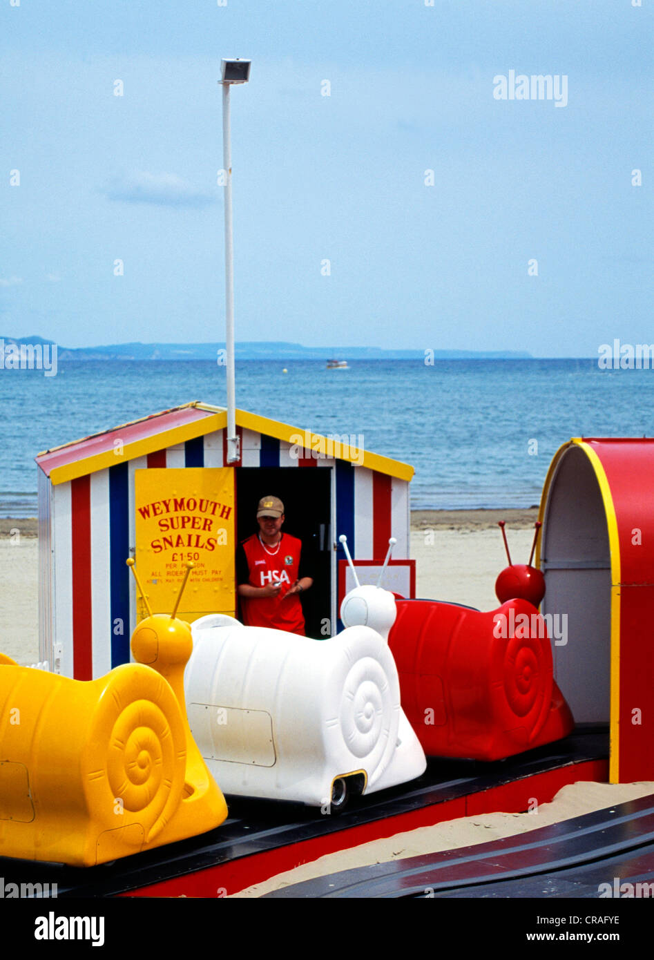 Super snails fun fair ride on Weymouth Seafront Stock Photo - Alamy