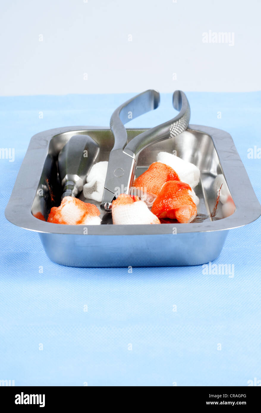 Cuvette with dental tools to removing teeth Stock Photo - Alamy