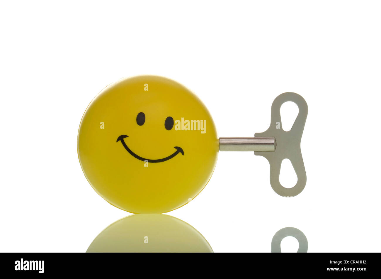 Smiley with a winding key Stock Photo - Alamy