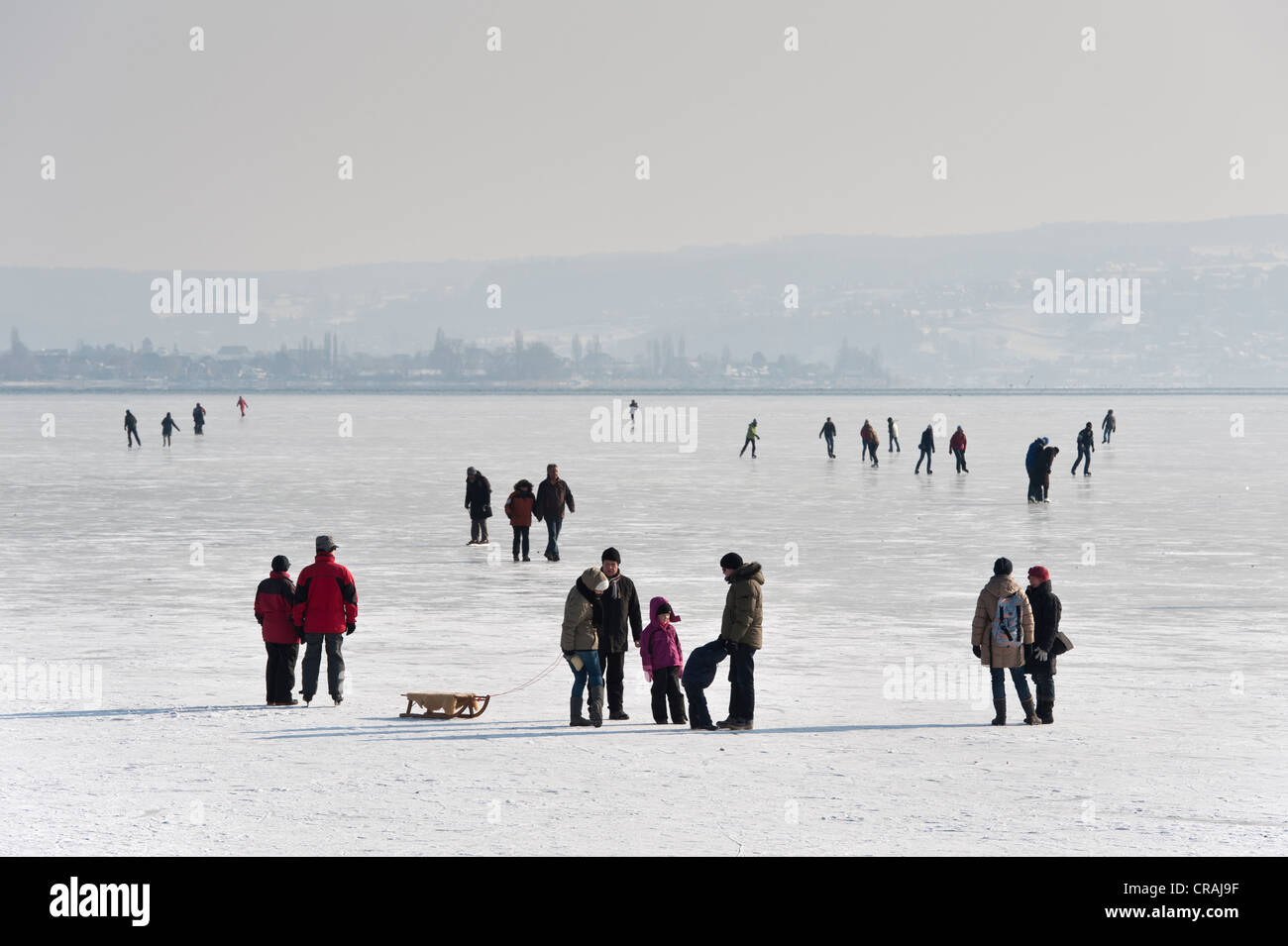 People walking on the ice of a frozen Lake Constance, Markelfinger ...