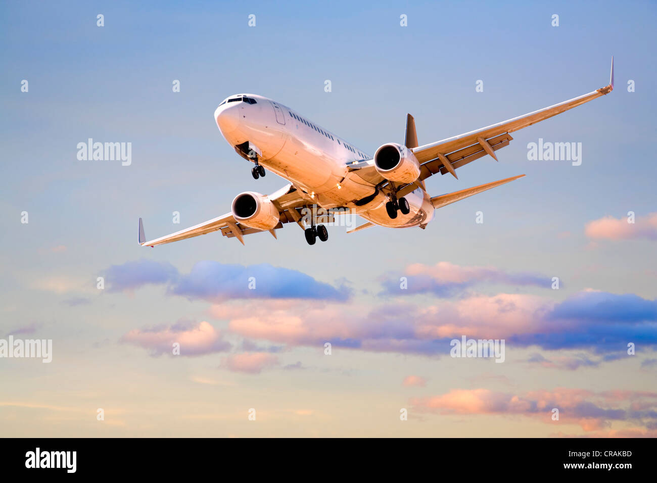 Boeing 737 flying in beautiful sunset sky Stock Photo - Alamy