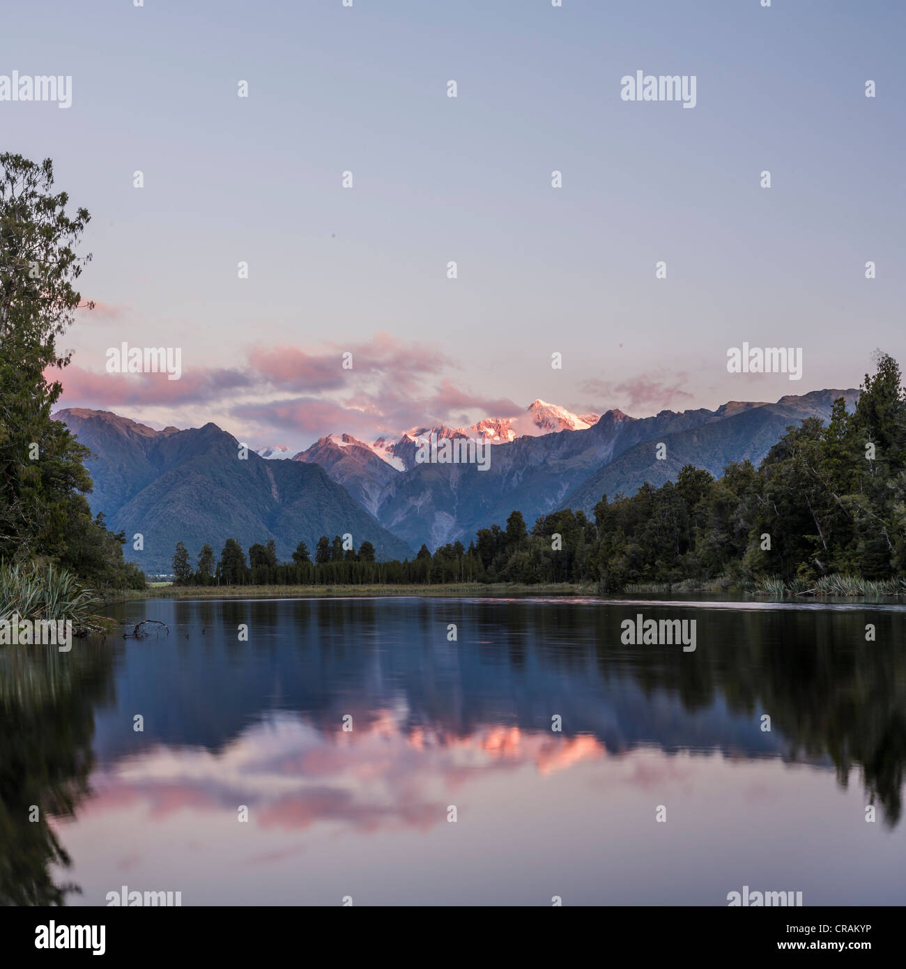 Lake Matheson at sunset with snow covered Mount Cook, New Zealand's ...