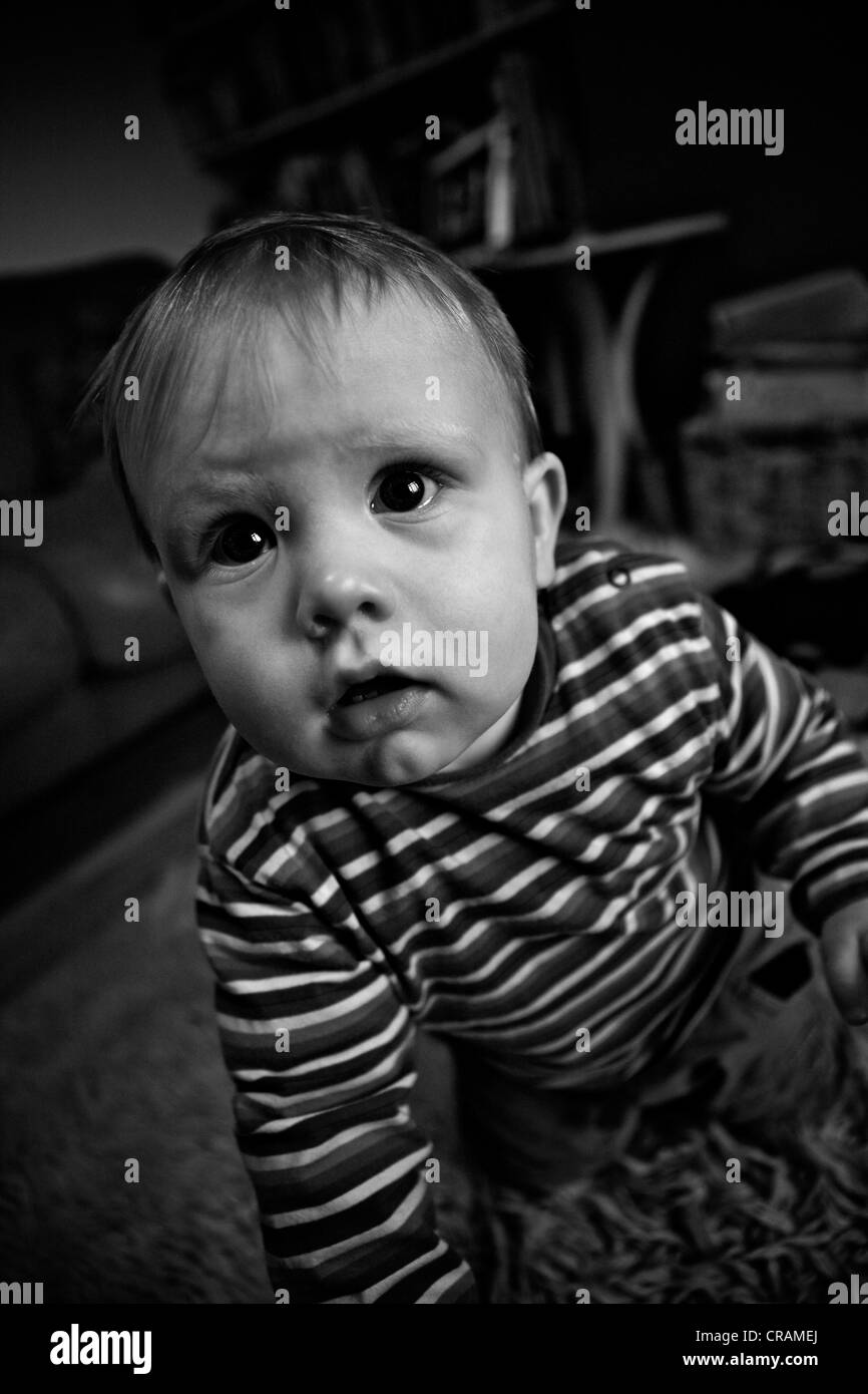 baby boy looking apprehensive worried scared Stock Photo - Alamy