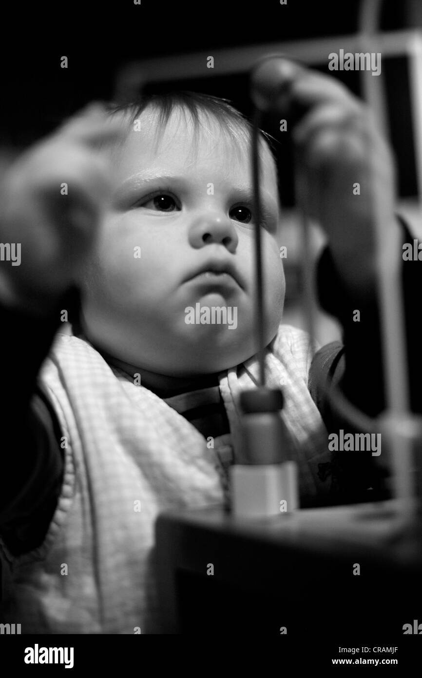 baby boy playing with toy Stock Photo - Alamy