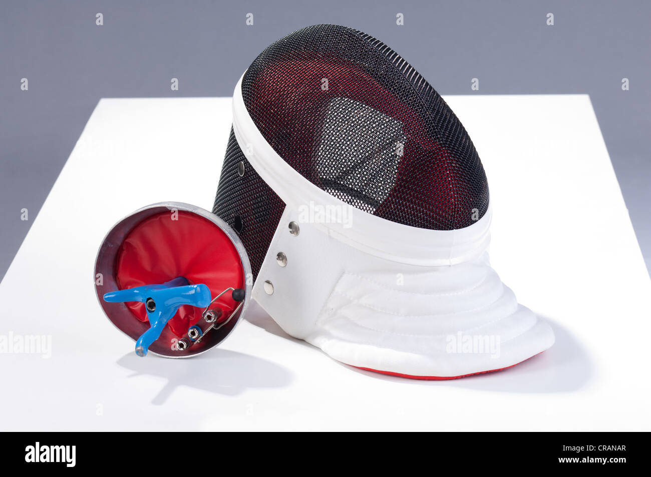 fencers sword and mask on a white background Stock Photo - Alamy