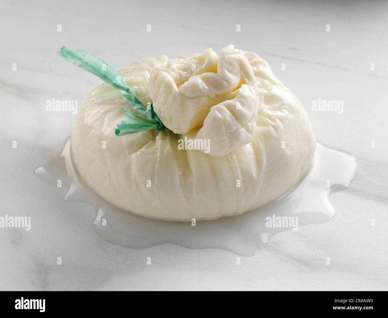 A whole Burrata Italian soft cheese on a marble background Stock Photo ...
