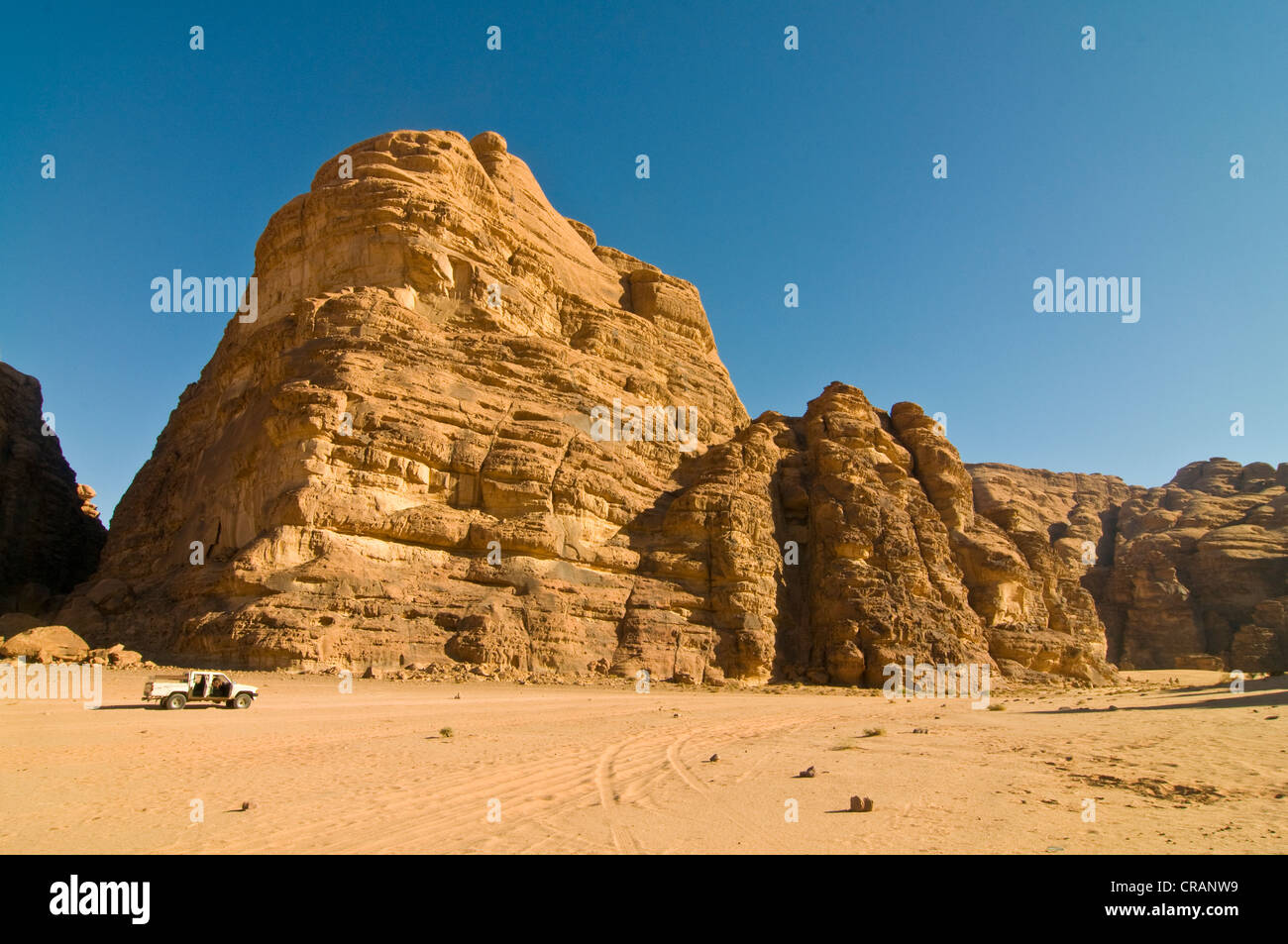 Rocks, an off-road vehicle in front, desert, Wadi Rum, Jordan, Middle ...