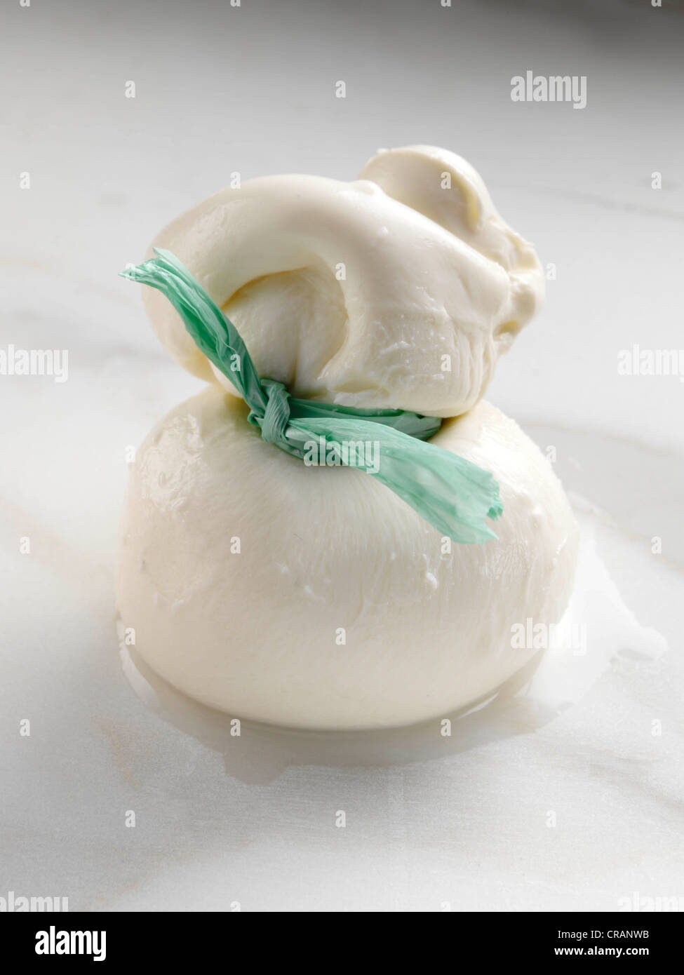 A whole Burrata Italian soft cheese Stock Photo - Alamy