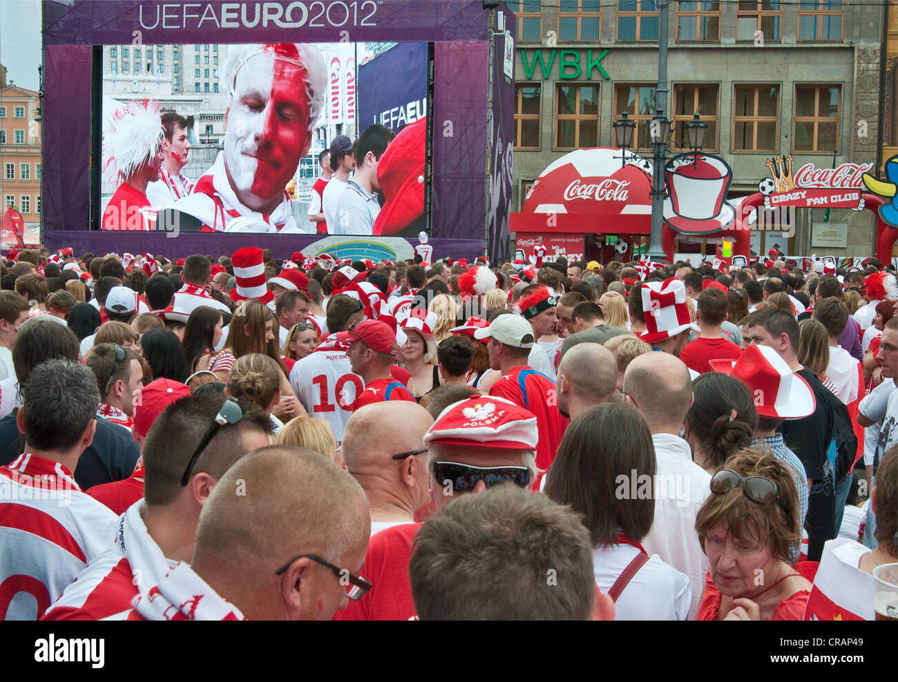 Soccer fans waiting to watch Poland vs Czech Rep match on TV screen ...
