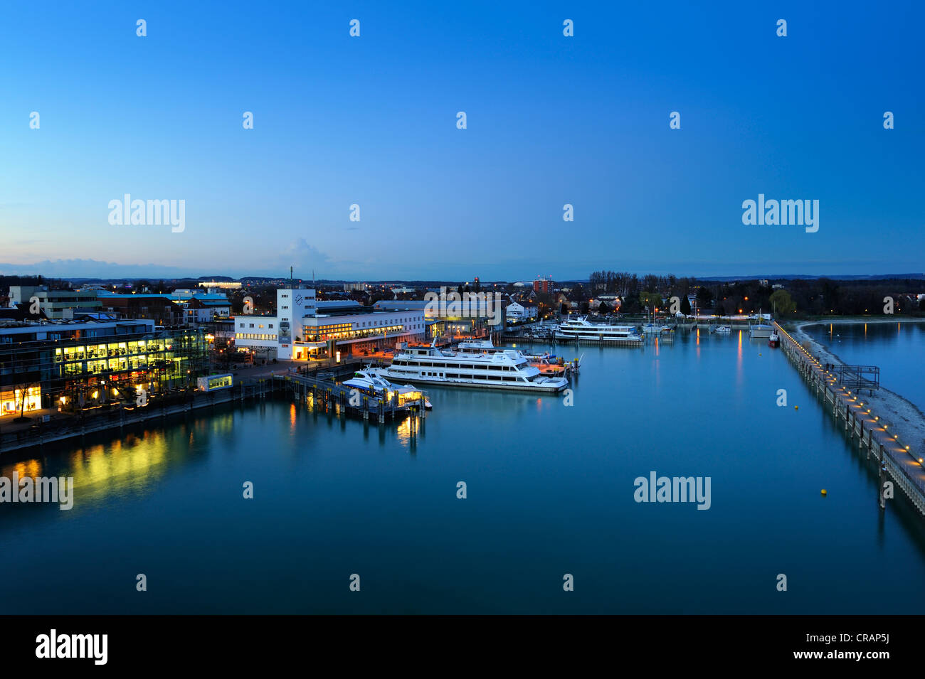 The ferry port with the Zeppelin Museum, on the left the Medienhaus ...