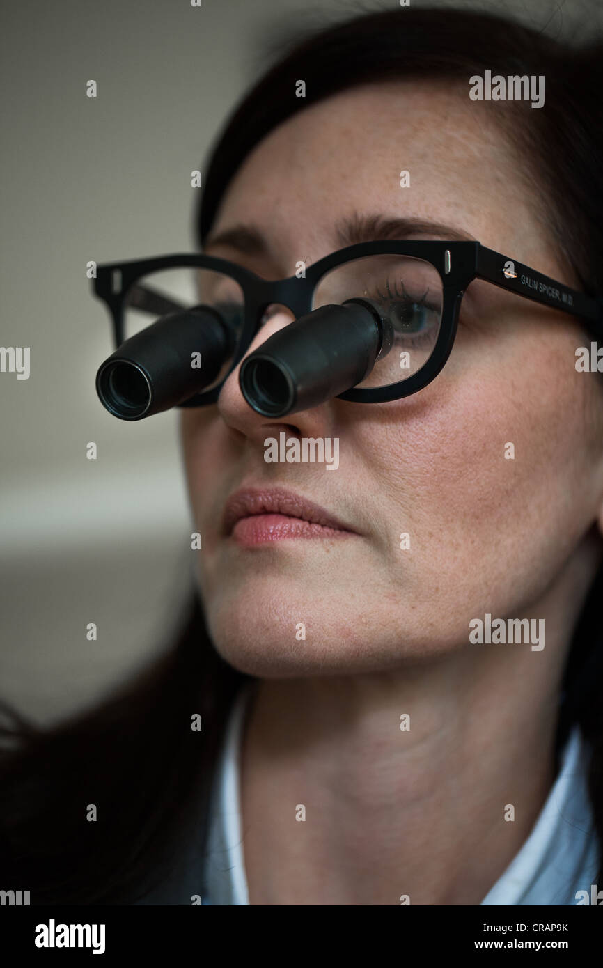 An eye doctor examines a patient Stock Photo - Alamy