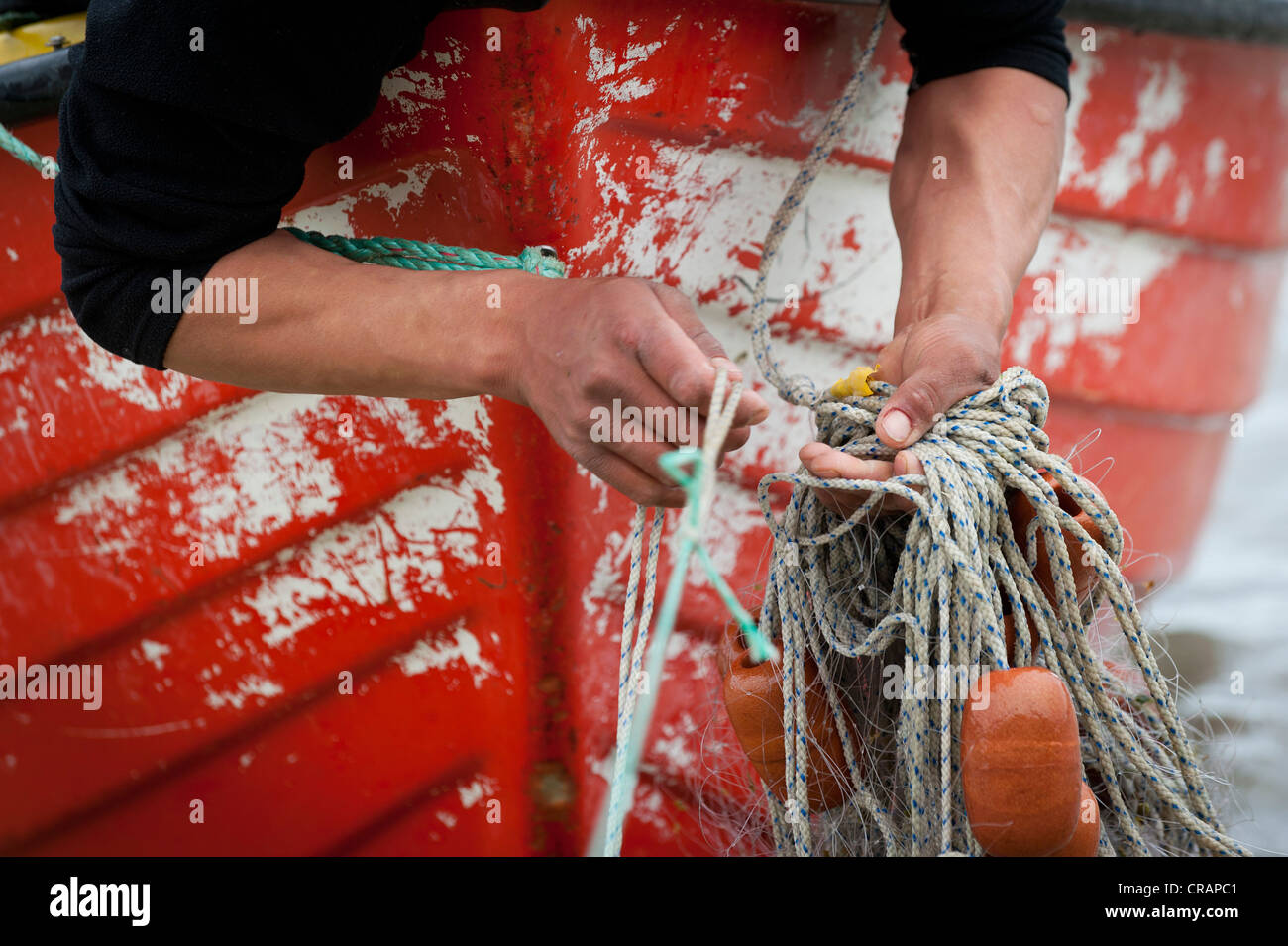 Inuit hunter fishing for salmon near the Inuit settlement of ...
