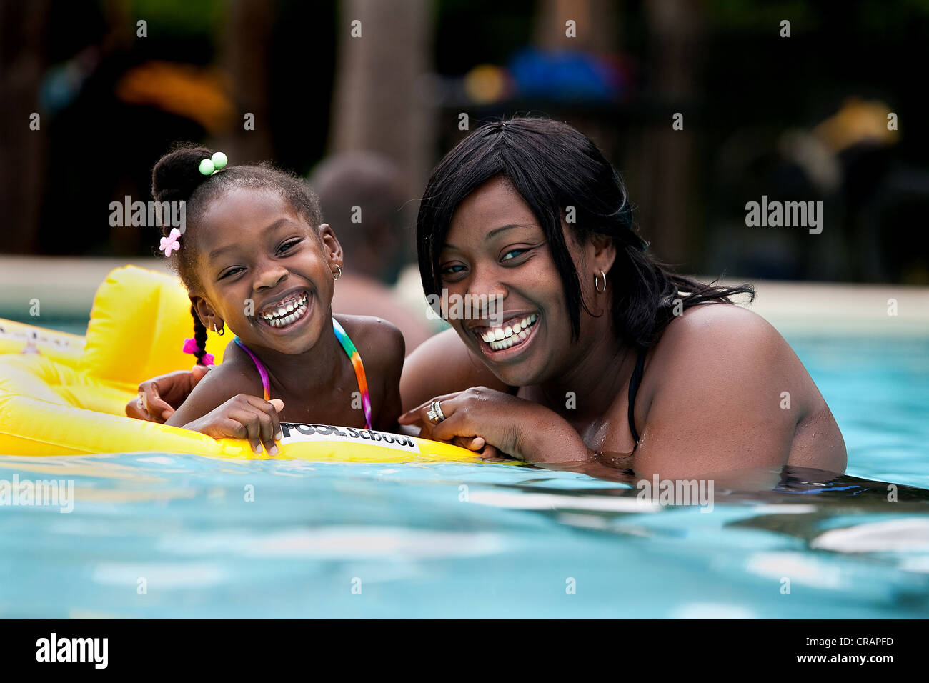 Mother and daughter enjoy the swimming pool Stock Photo - Alamy