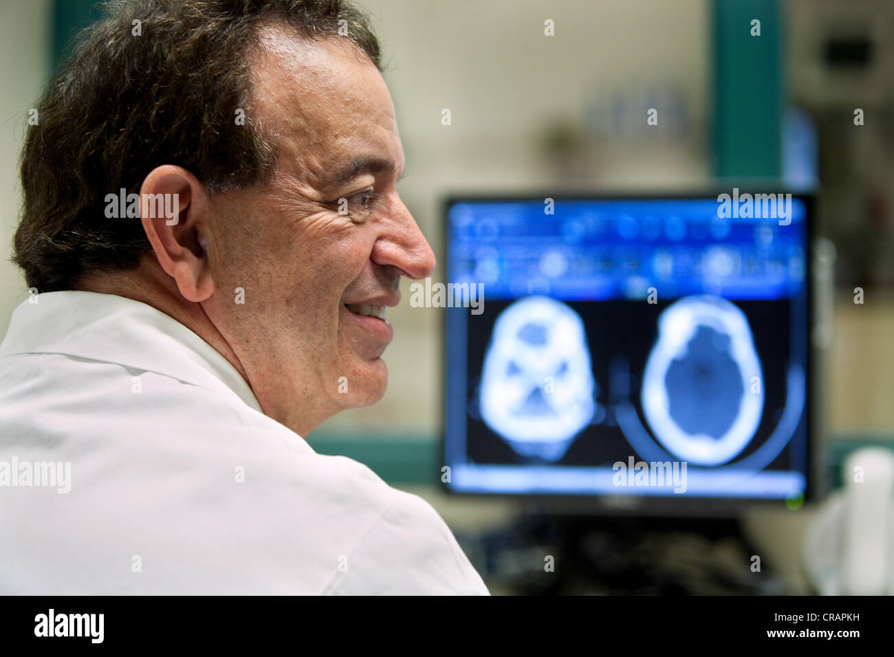 Doctor looks over scans Stock Photo - Alamy