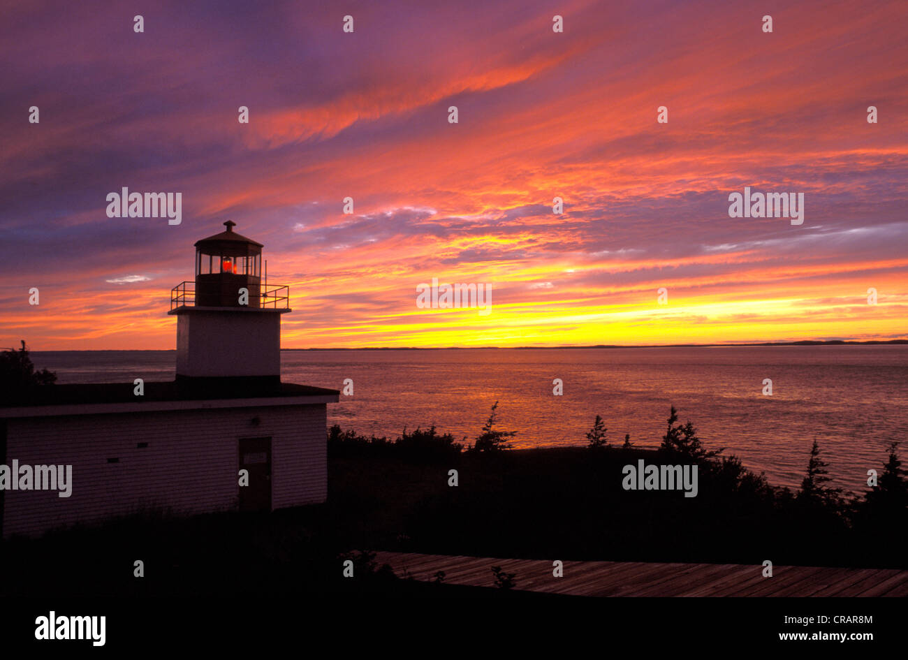 Lighthouse at sunset on Grand Manan Island New Brunswick Canada Stock Photo - Alamy
