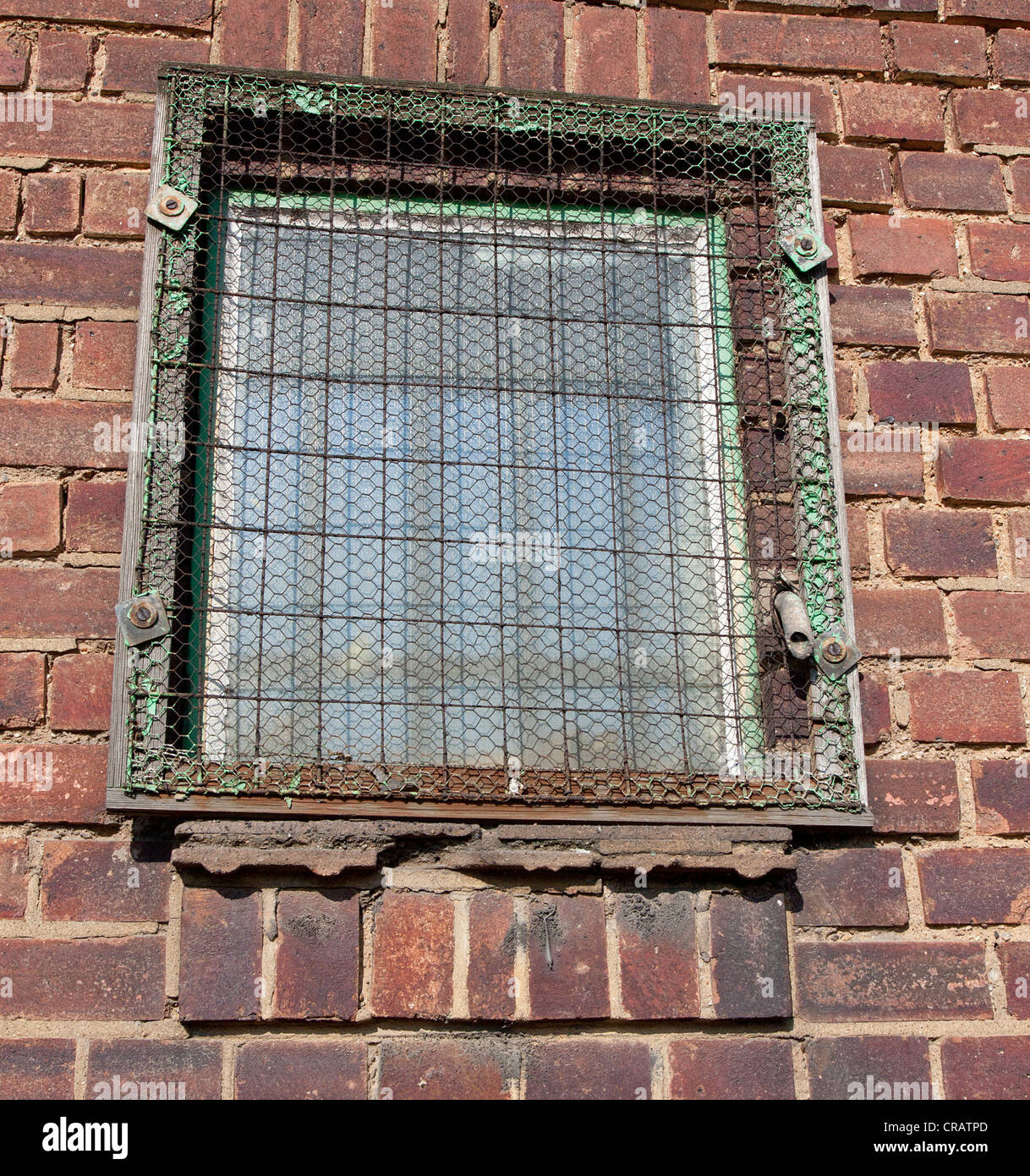 Old Security Grill over window in brick wall Stock Photo - Alamy
