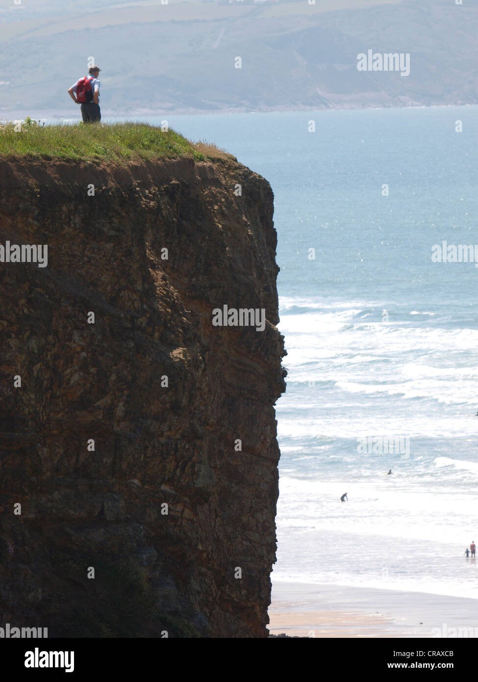 Walker standing on cliff top, Bude, Cornwall, UK Stock Photo - Alamy