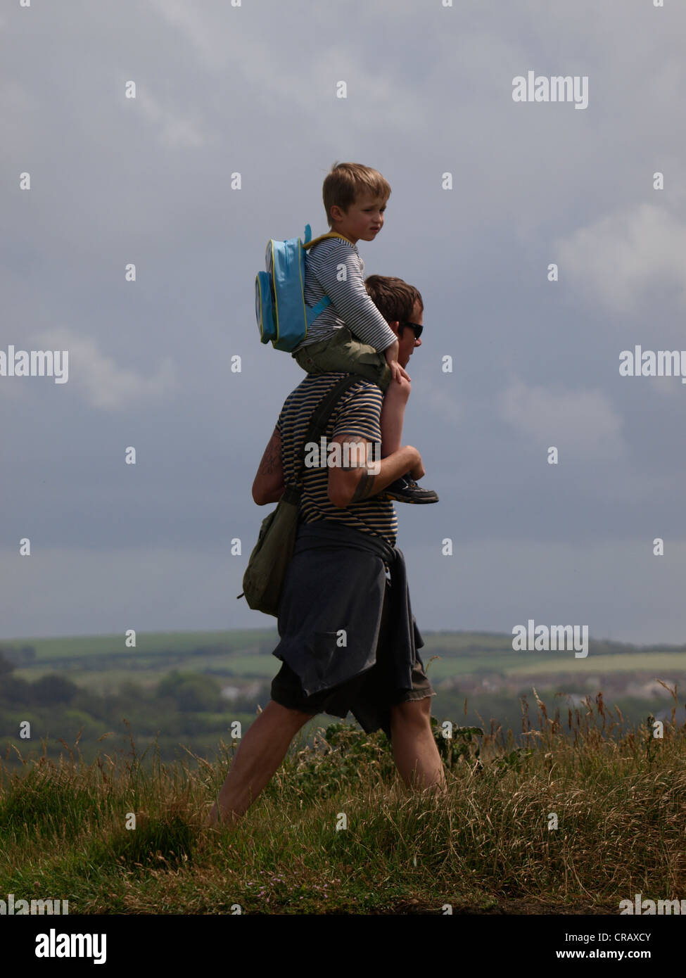 Son riding on fathers shoulders hi-res stock photography and images - Alamy