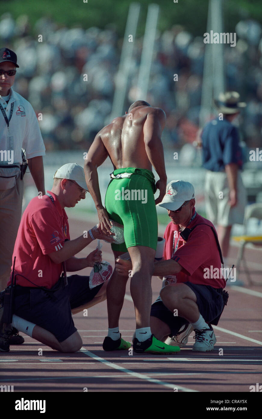 Maurice Green being attended to after pulling up at the 2000 US Olympic ...