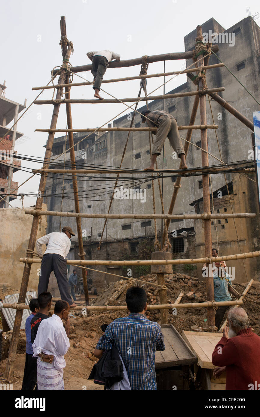 Man On A Bamboo Scaffolding High Resolution Stock Photography and ...