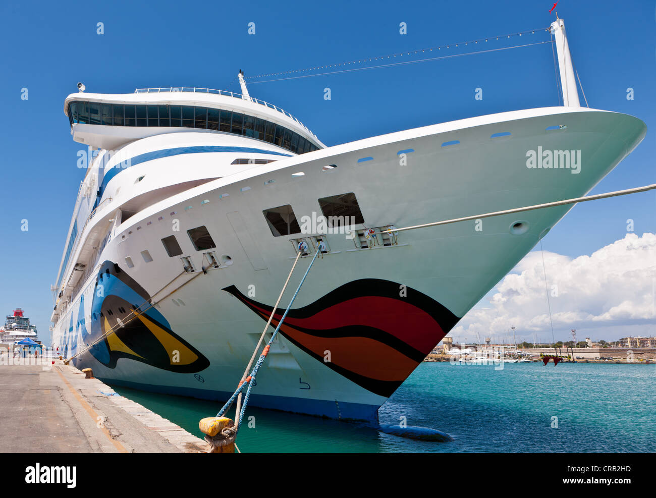 Brightly painted cruise ship, AIDA, in the port of Civitavecchia, Rome ...