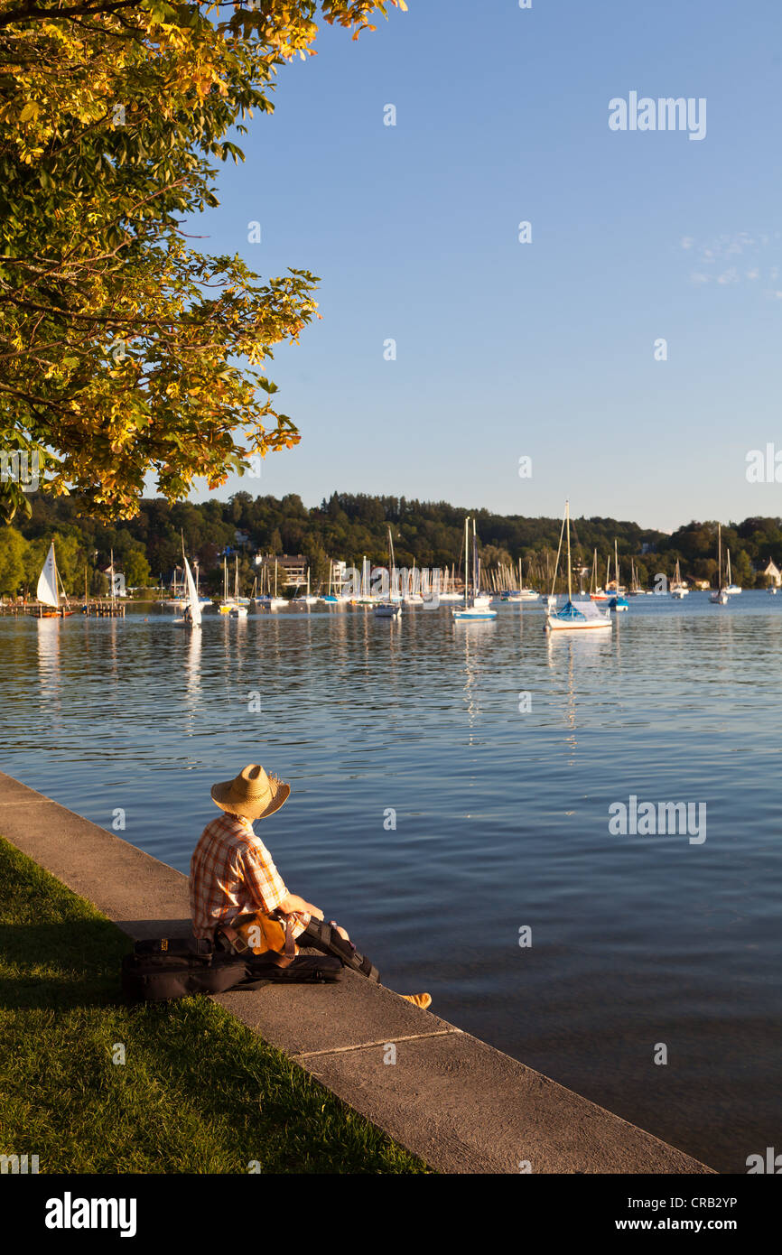 Man overlooking Ammersee Lake, Lake Ammer, evening light, Herrsching am ...