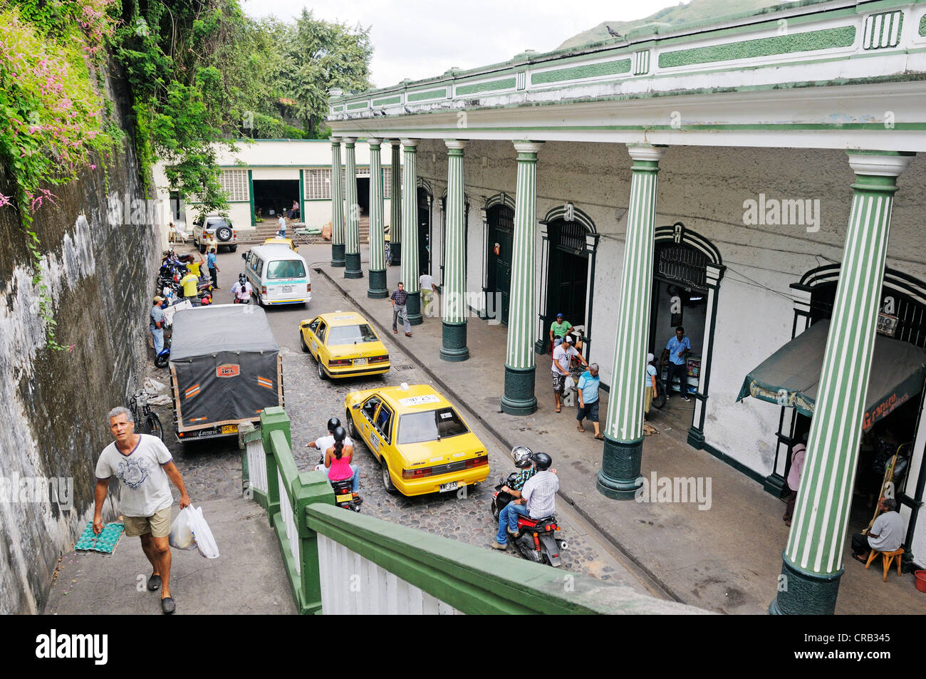 Historic market hall with columns and arcades, city of Honda, Colombia ...