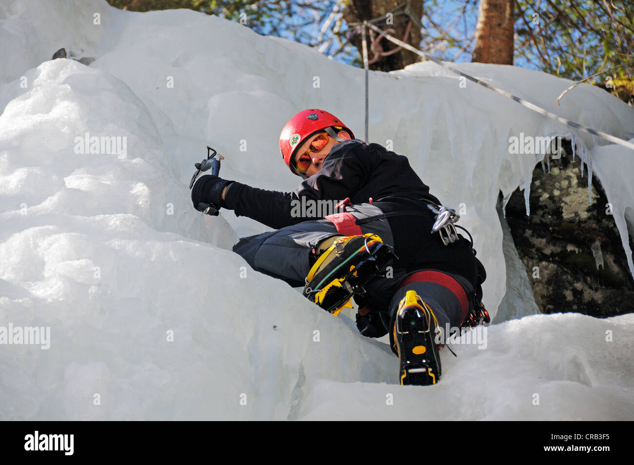 Man climbs frozen waterfall hi-res stock photography and images - Alamy