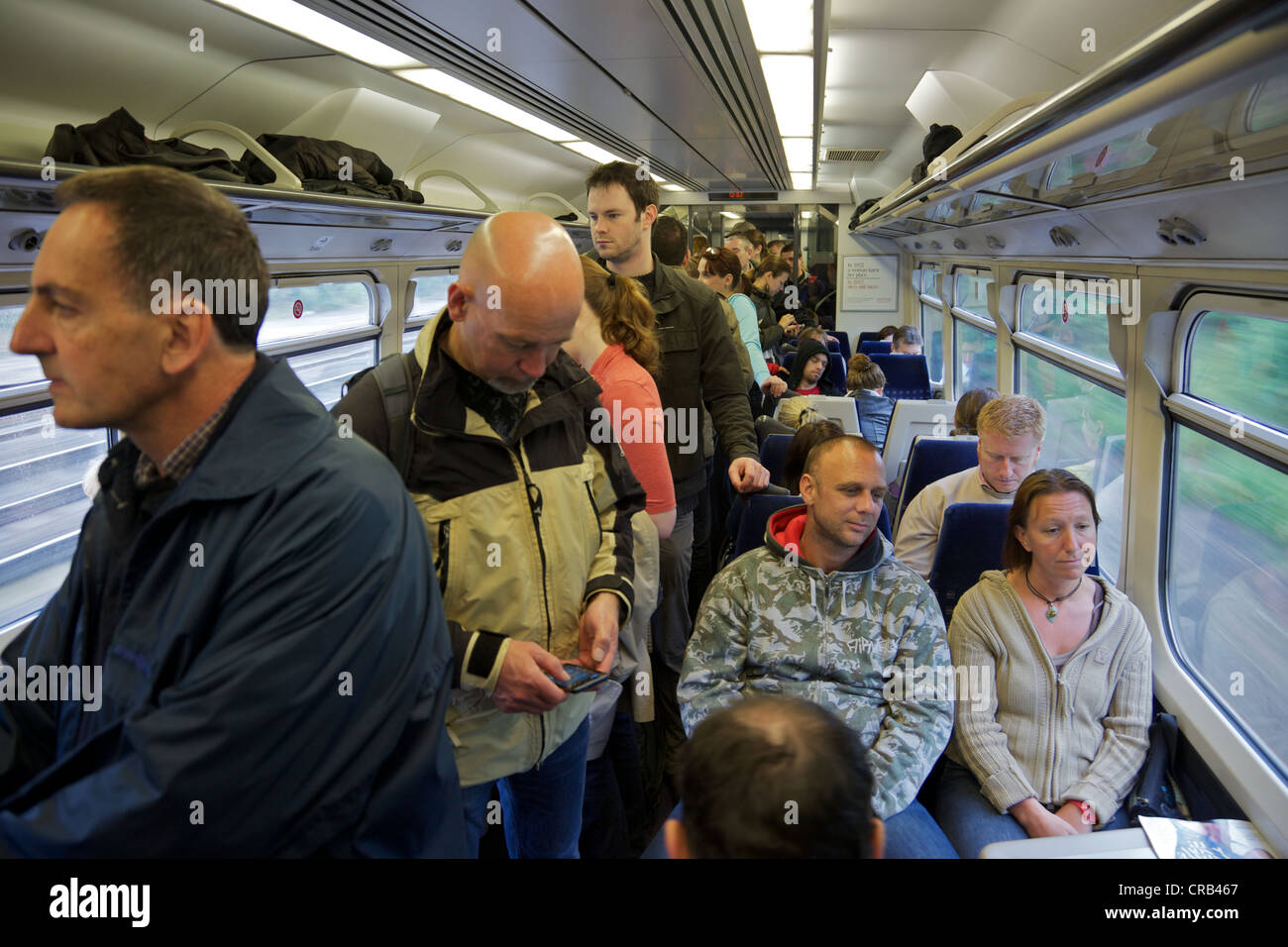 A crowded commuter train on the way to London, England Stock Photo - Alamy