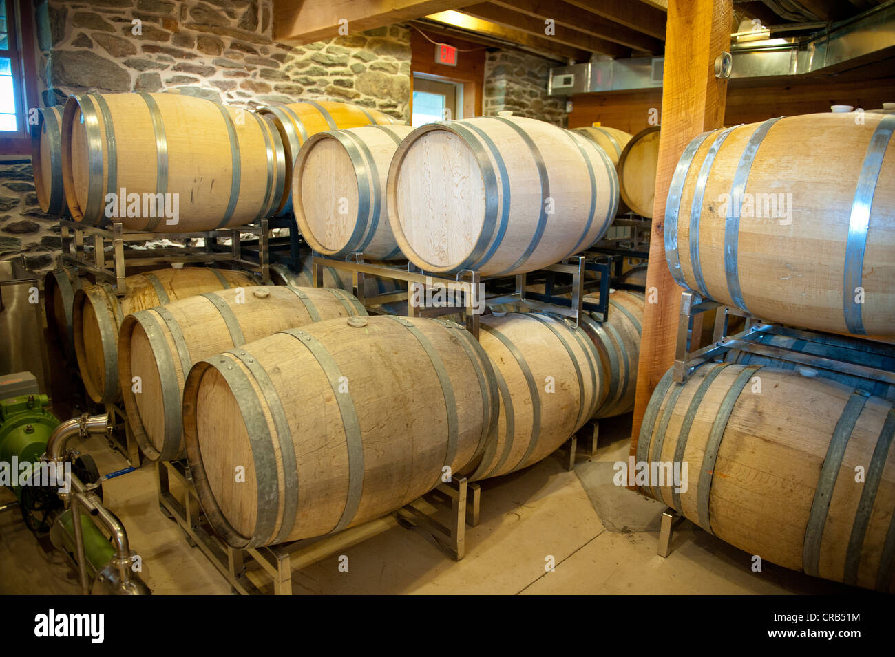 Stacked wooden barrels containing wine in wine cellar Stock Photo - Alamy