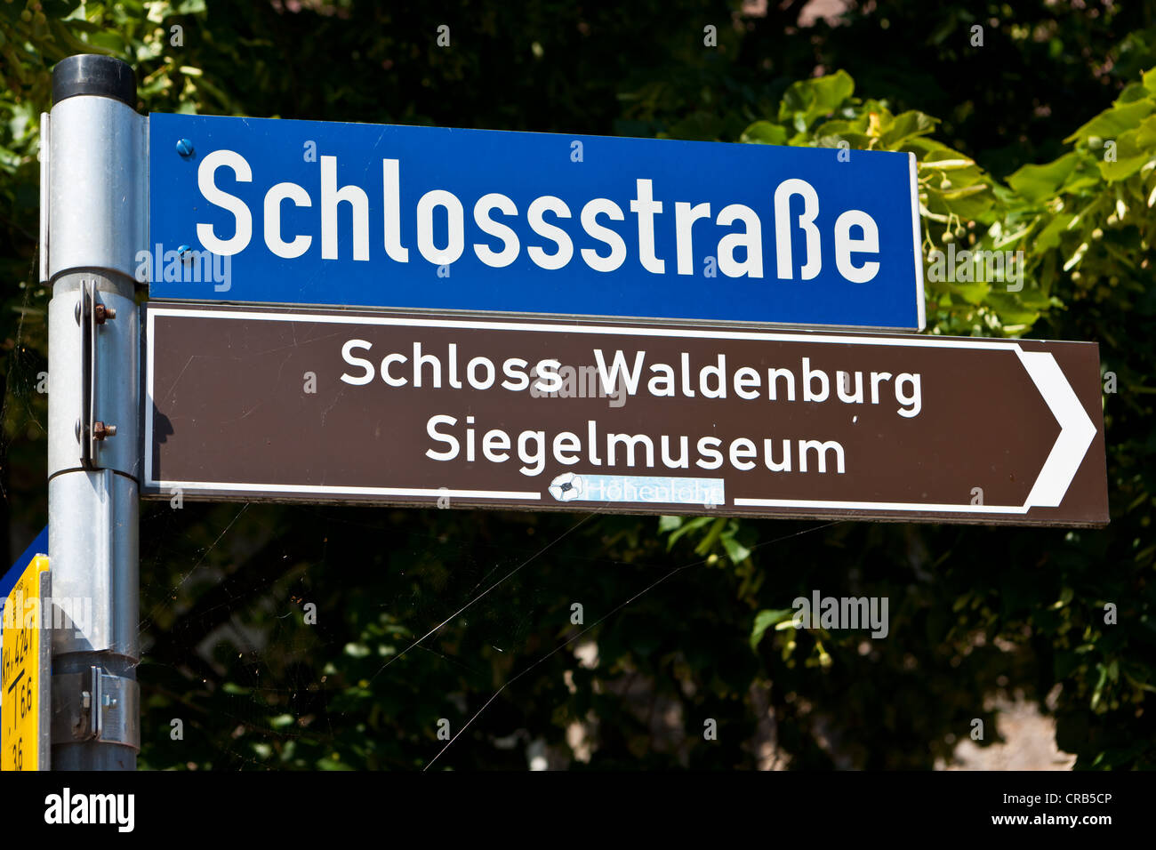 Street sign for Schlossstrasse and a sign directing to Schloss ...