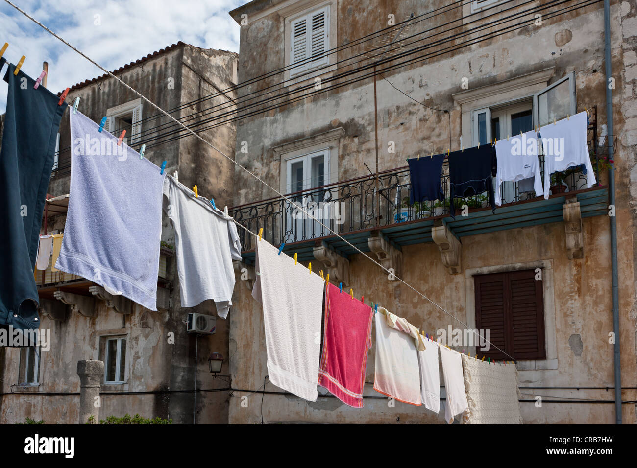 Alleyway with clothes on washing lines in the historic centre of ...