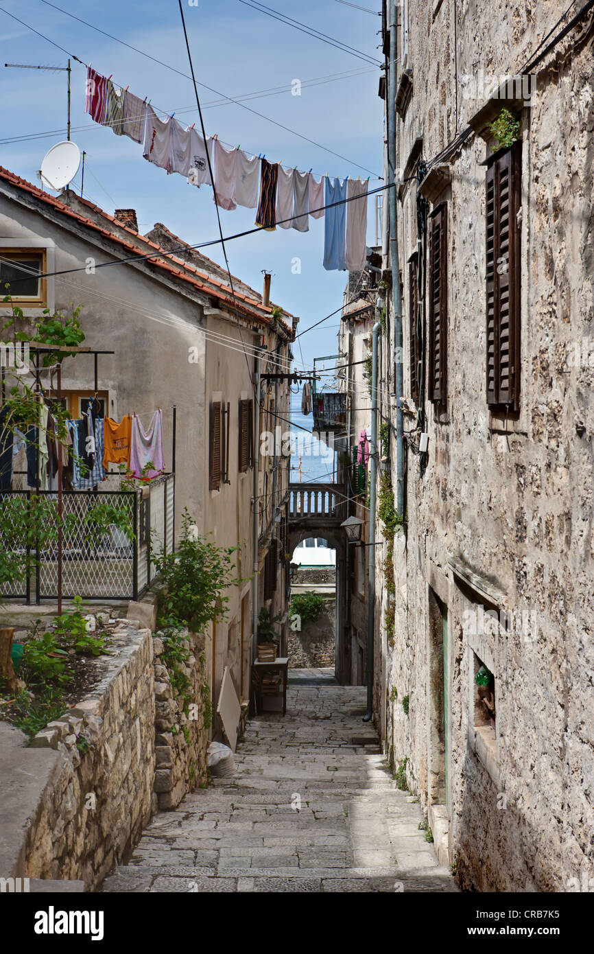 Alleyway with clothes on washing lines in the historic centre of ...
