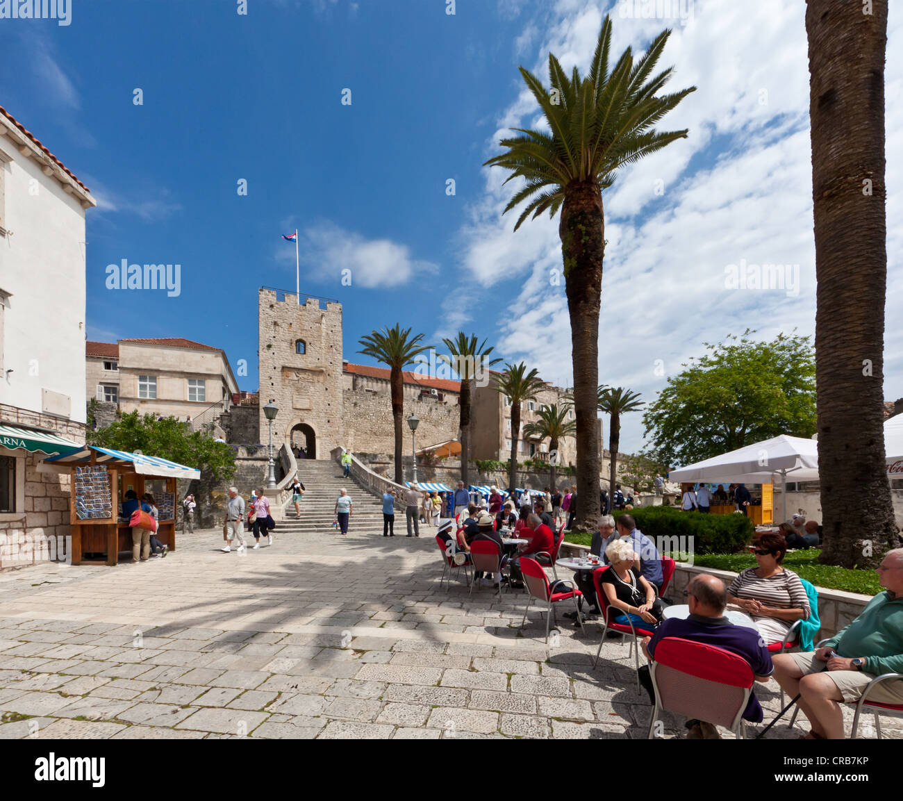 Historic centre of Korcula with tourists in front of the castle ...