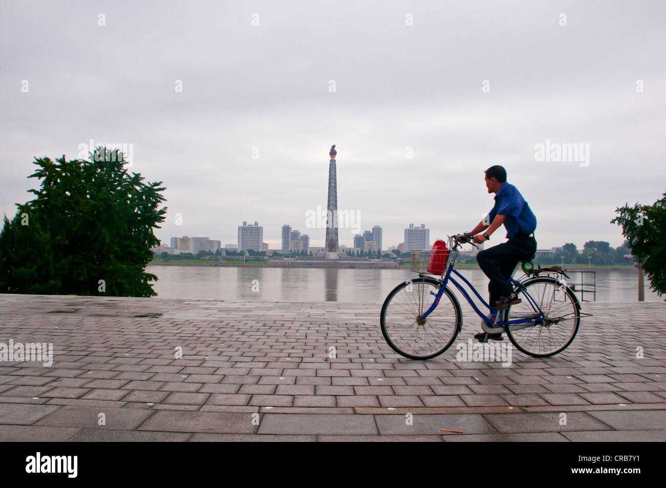 Cyclist in front of the Juche Tower, Pyongyang, North Korea, Asia Stock ...