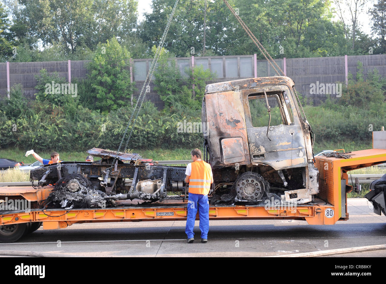 A burned-out truck engine on a flatbed truck for removal on the A8 ...