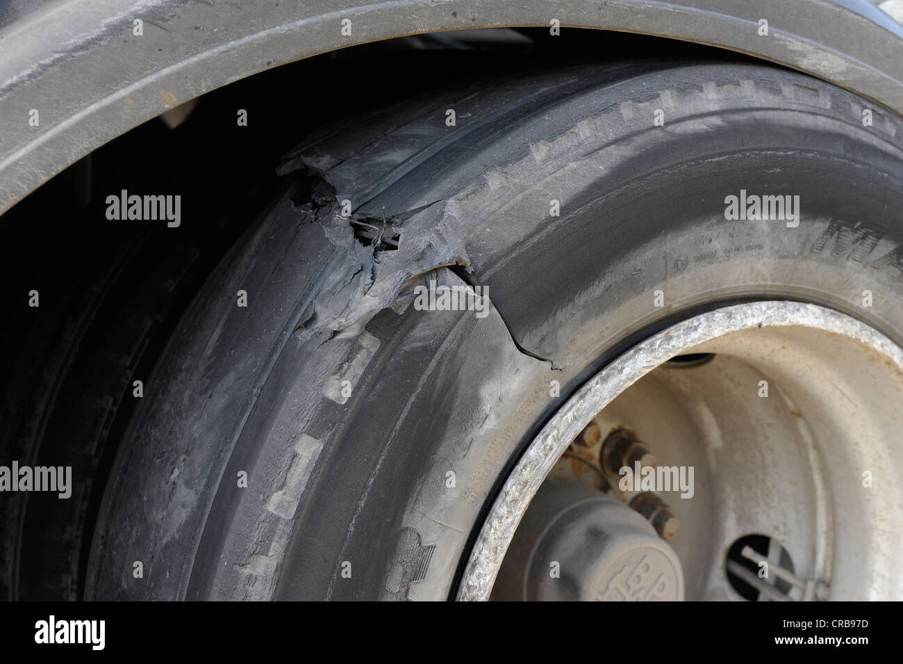 Burst tire of a truck after an accident, puncture Stock Photo, Royalty ...