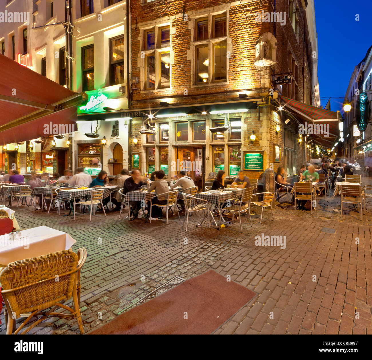 Guests sitting in street restaurants in the old town, Beenhouwersstraat ...