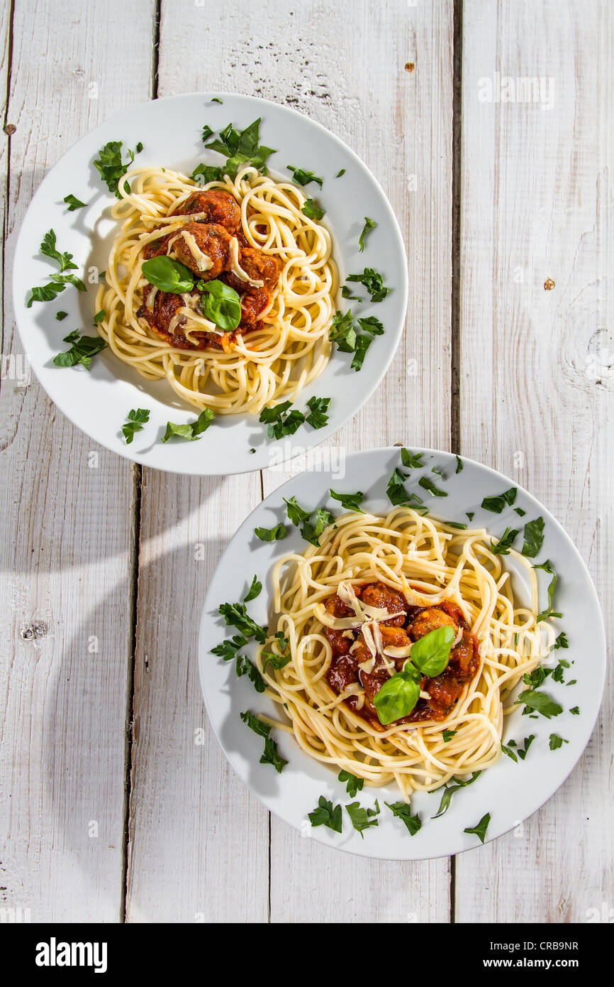 Spaghetti for two seasoned with fresh spices Stock Photo - Alamy